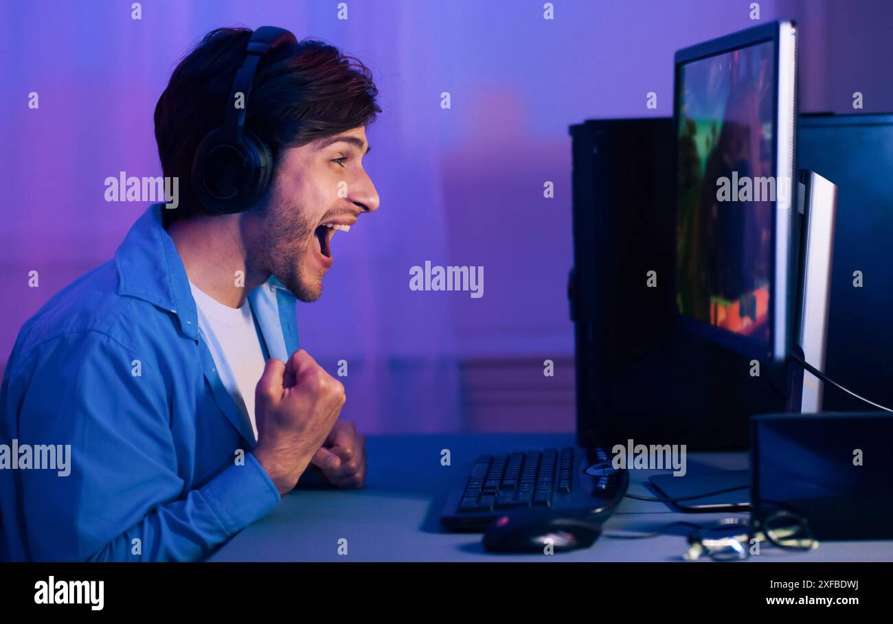 Excited Gamer Celebrates Victory While Playing Video Games at Night ...