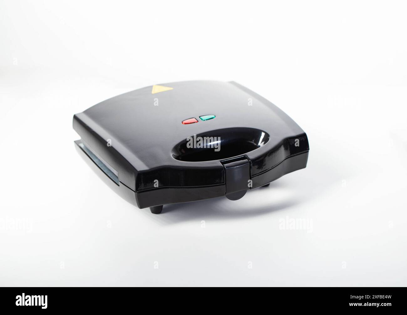 Black modern sandwich maker on a white background, isolate, close-up ...