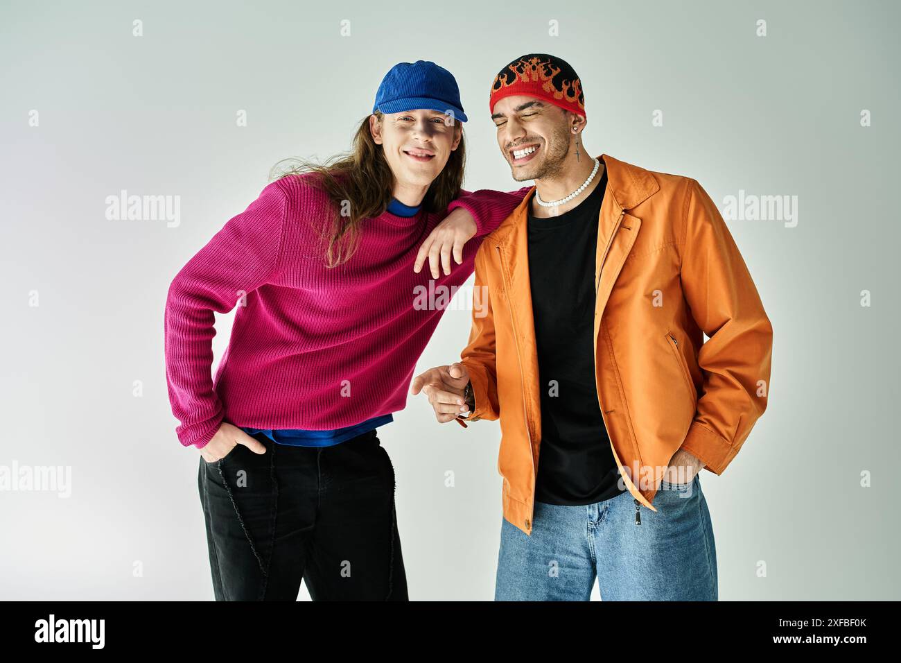 two men elegantly pose together for a snapshot Stock Photo - Alamy