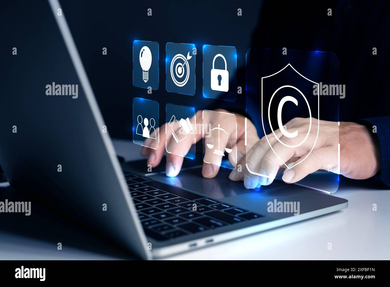 Businessman use laptop with virtual copyright symbol for author rights ...
