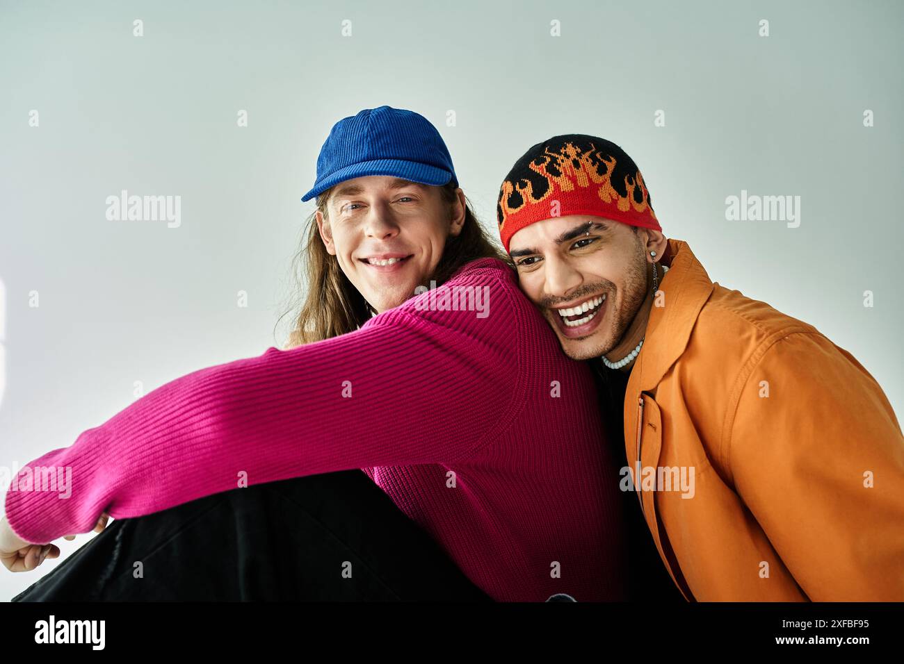 two men striking a pose for a stylish photo Stock Photo - Alamy