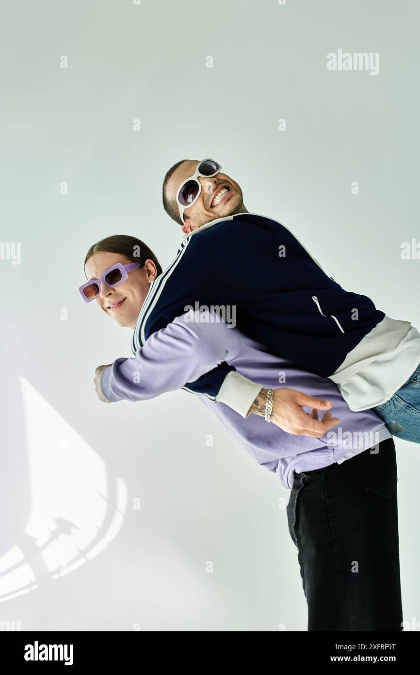 two men are posing for a picture Stock Photo - Alamy