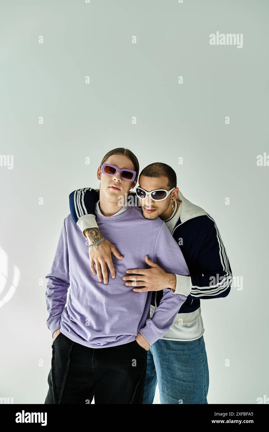 Two men embrace each other, sharing a moment of connection and ...