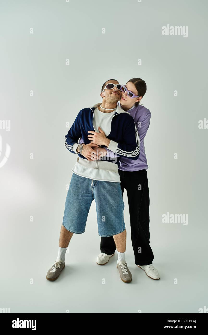 A stylish gay couple posing together gracefully Stock Photo - Alamy
