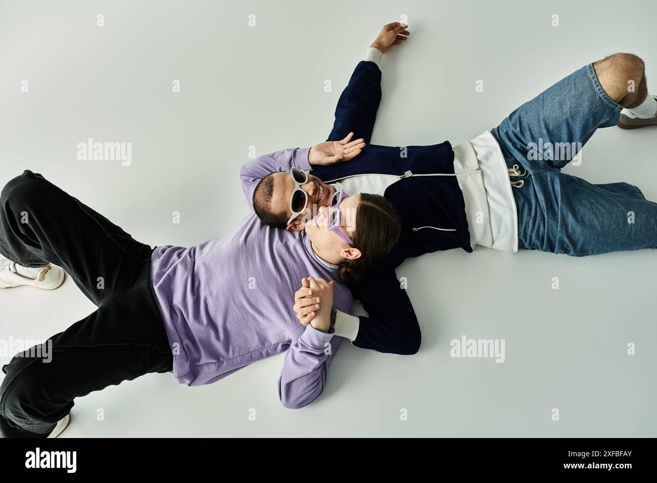 two men laying together peacefully Stock Photo - Alamy
