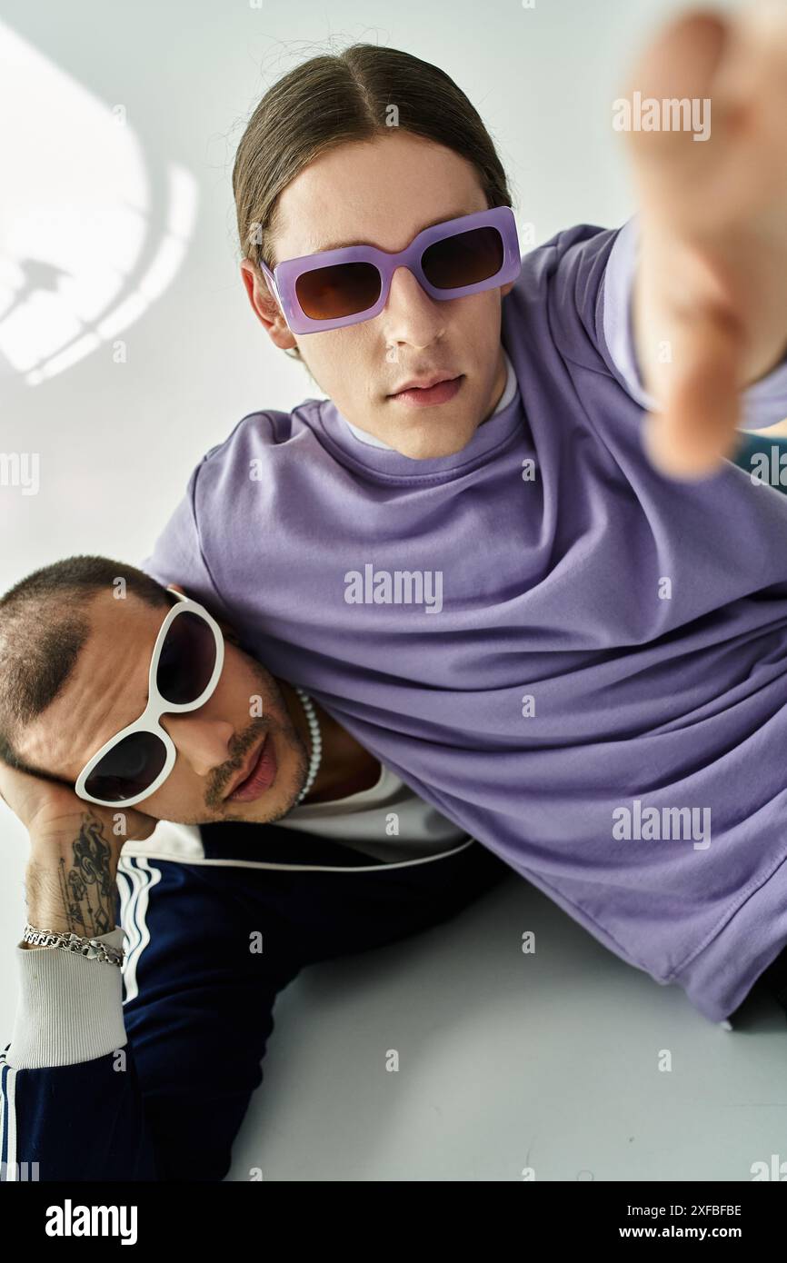 two men pose together for a picture Stock Photo - Alamy