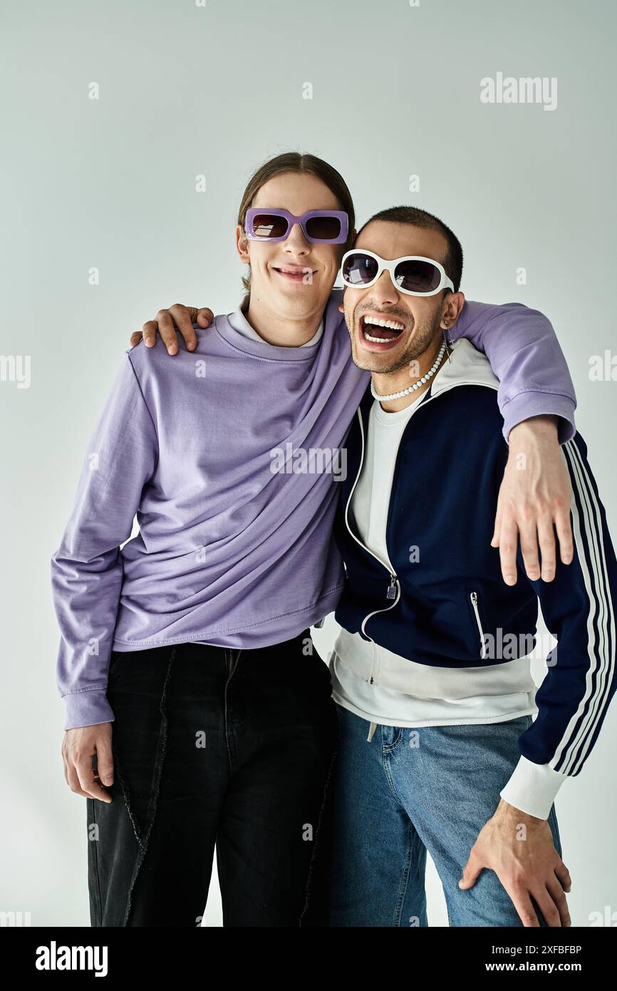 A gay couple poses wearing sunglasses Stock Photo - Alamy