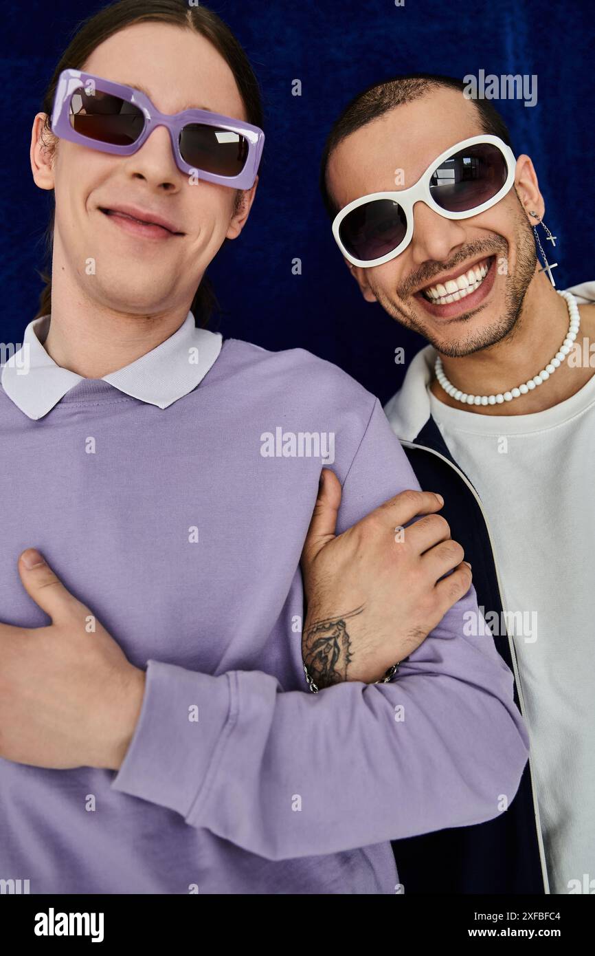 Two men, in sunglasses, stylishly posing Stock Photo - Alamy