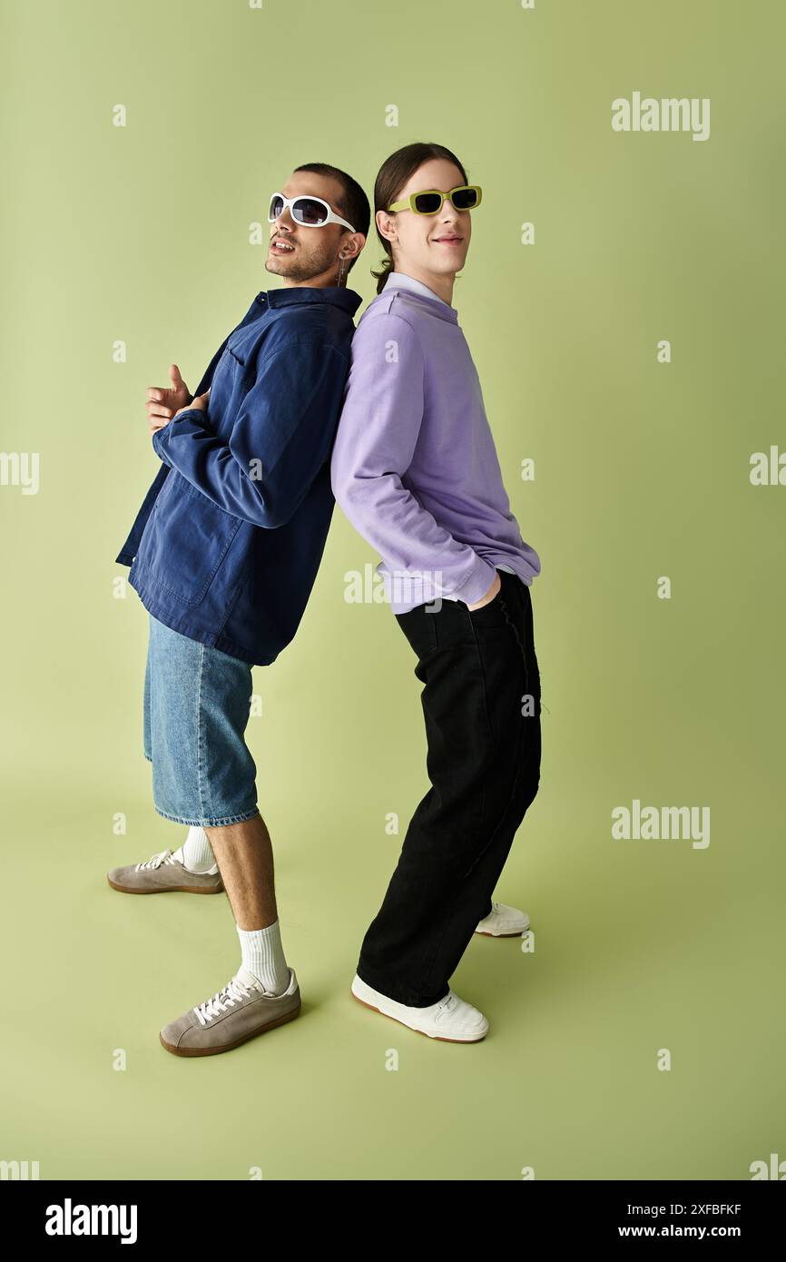 A gay couple, two men, stand joyfully together, enjoying quality time ...