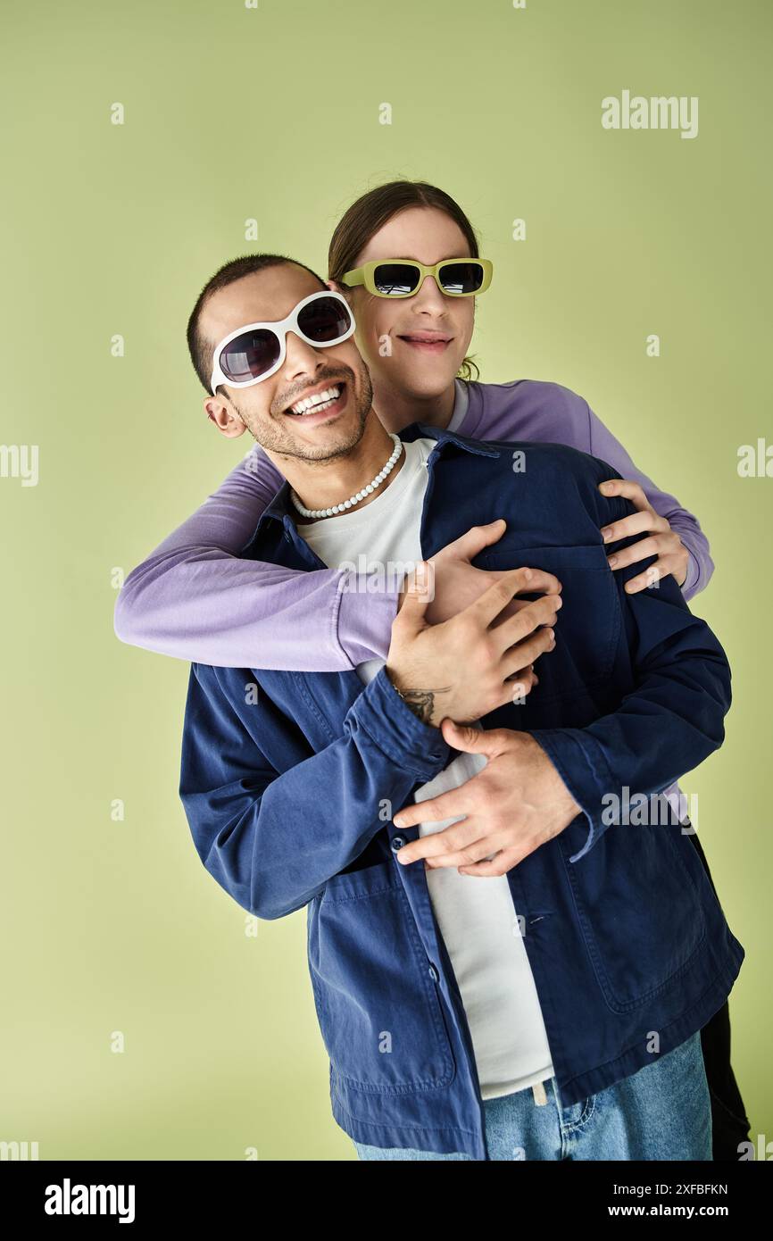 Happy gay couple hugging other hi-res stock photography and images - Alamy