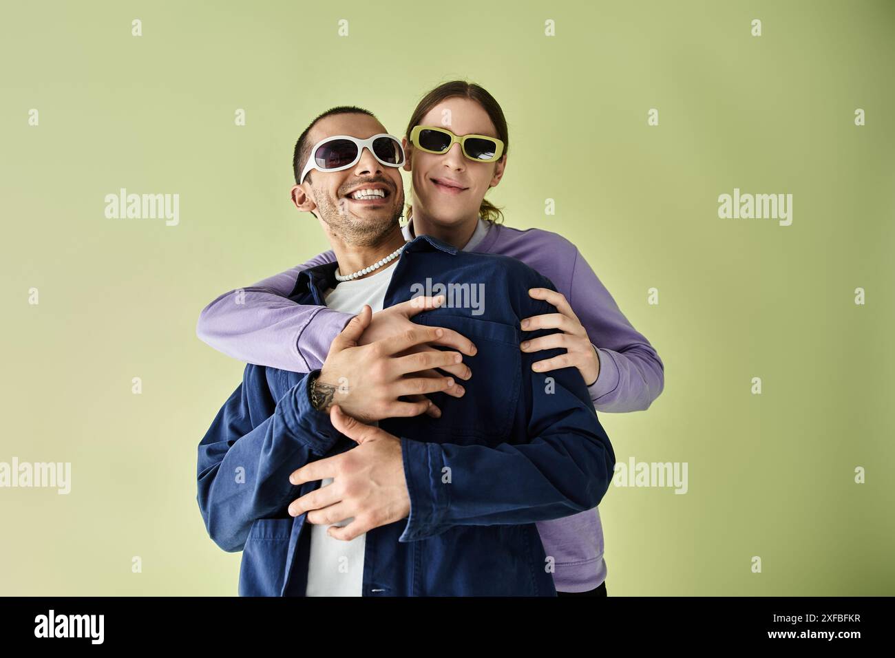 two men hold each other tightly in a warm, loving hug Stock Photo - Alamy