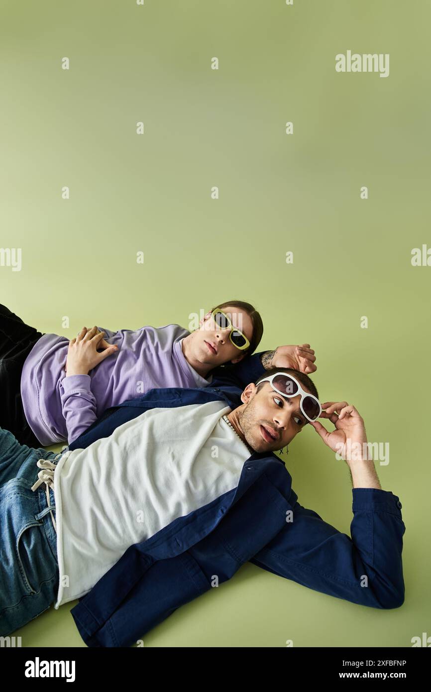 Two men lying near each other, showing their affection Stock Photo - Alamy