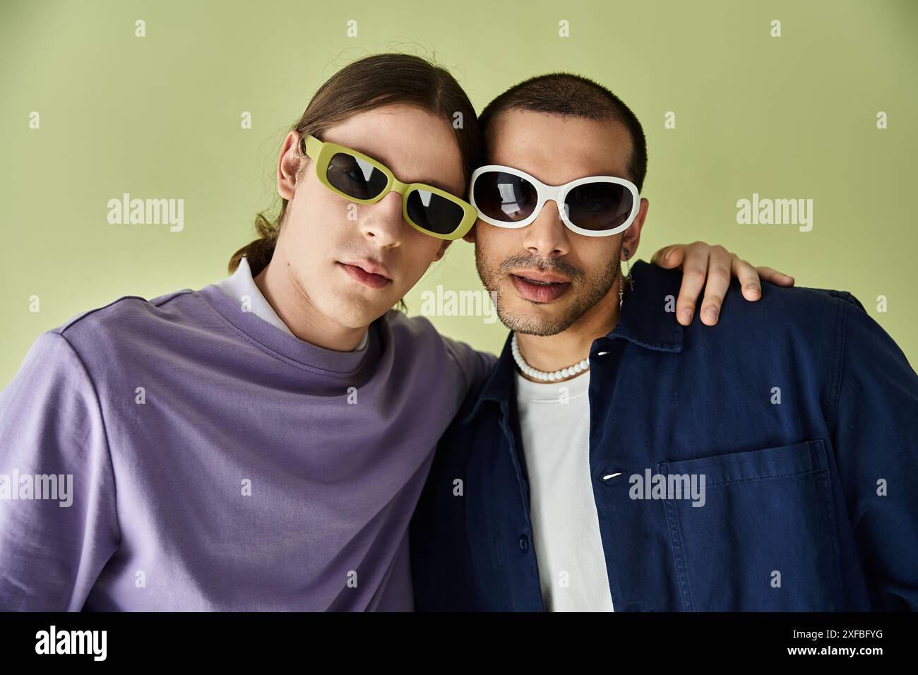 two men wearing sunglasses pose confidently for a picture Stock Photo ...