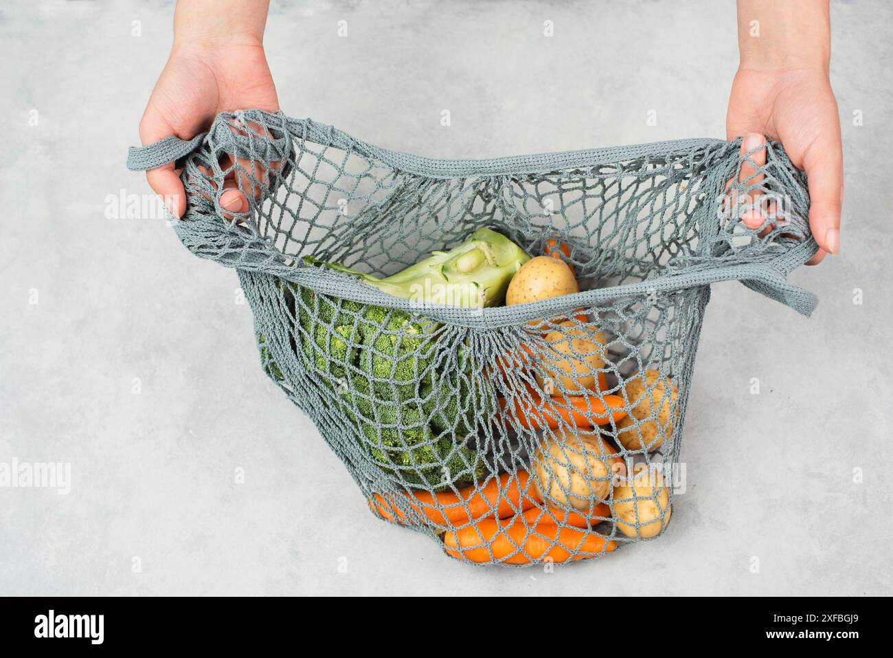 Mesh bag with vegetables, shopping grocery, healthy food ingredients ...
