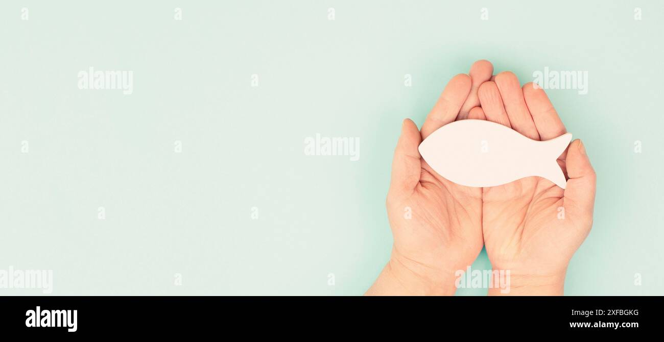 Confirmation, communion and baptism, hand holding fish, religious ...