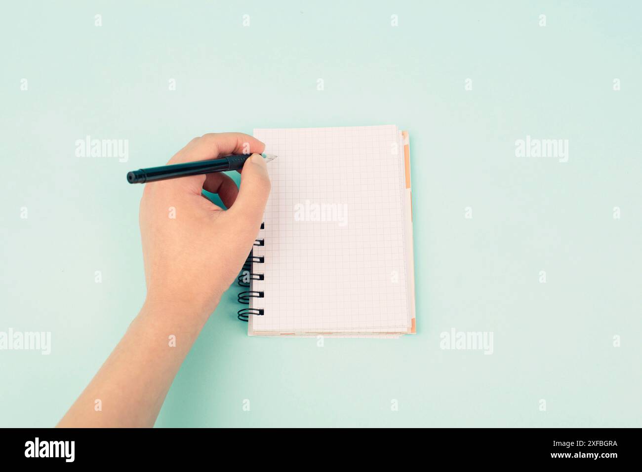 Left handers day, empty notebook, writing with the left hand, pen and ...