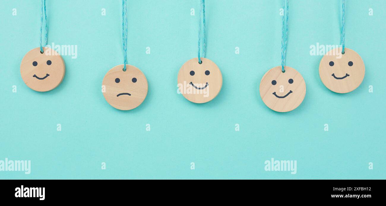 Happy smiling face spread happiness to sad faces, newton cradle concept ...
