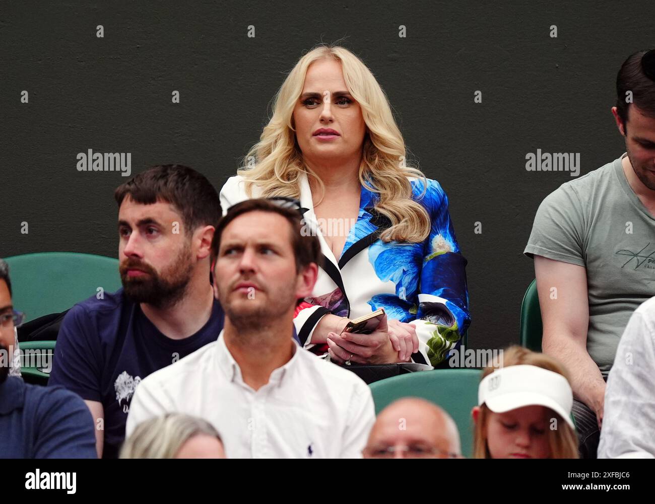 Rebel Wilson watches the centre court action between Novak Djokovic and ...