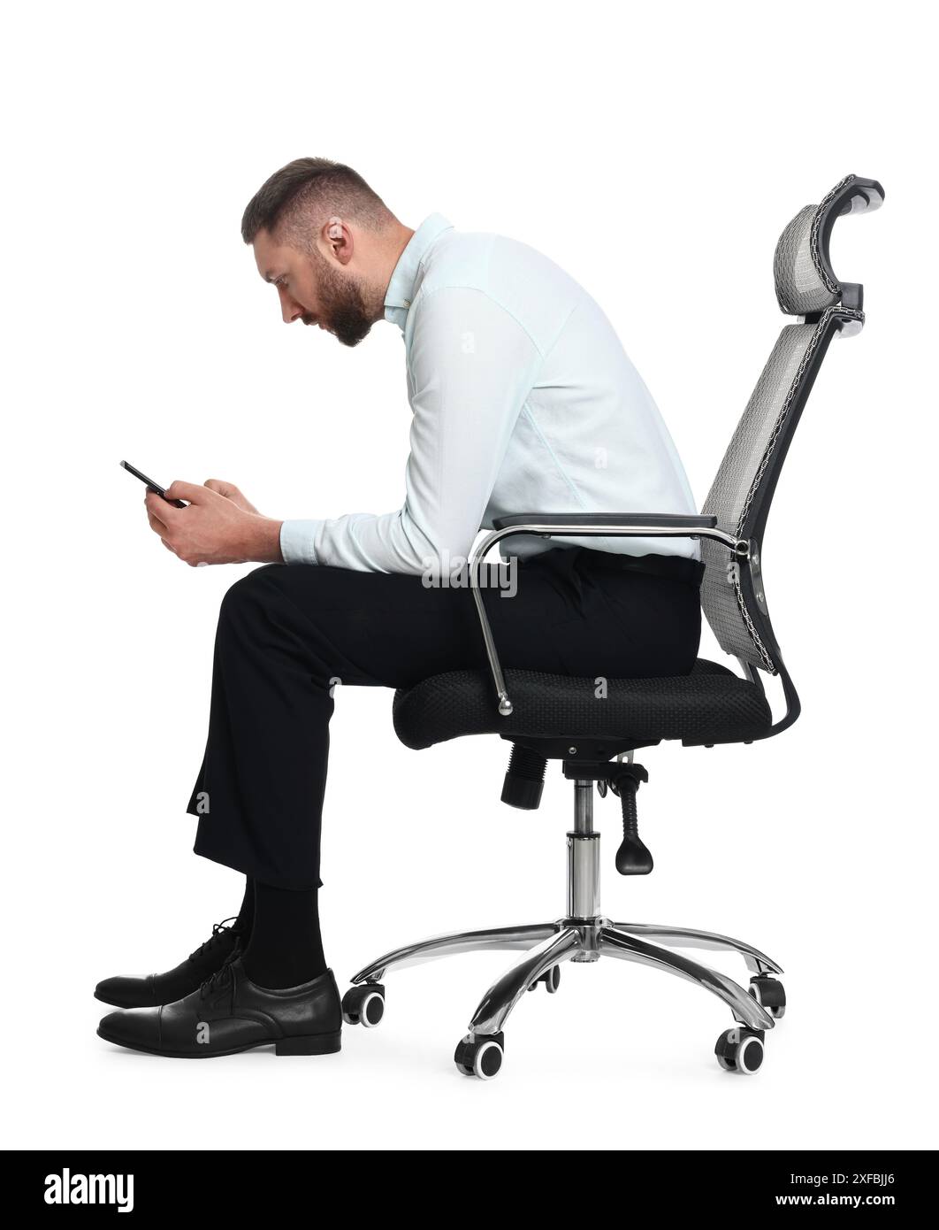 Man with poor posture sitting on chair and using smartphone against ...