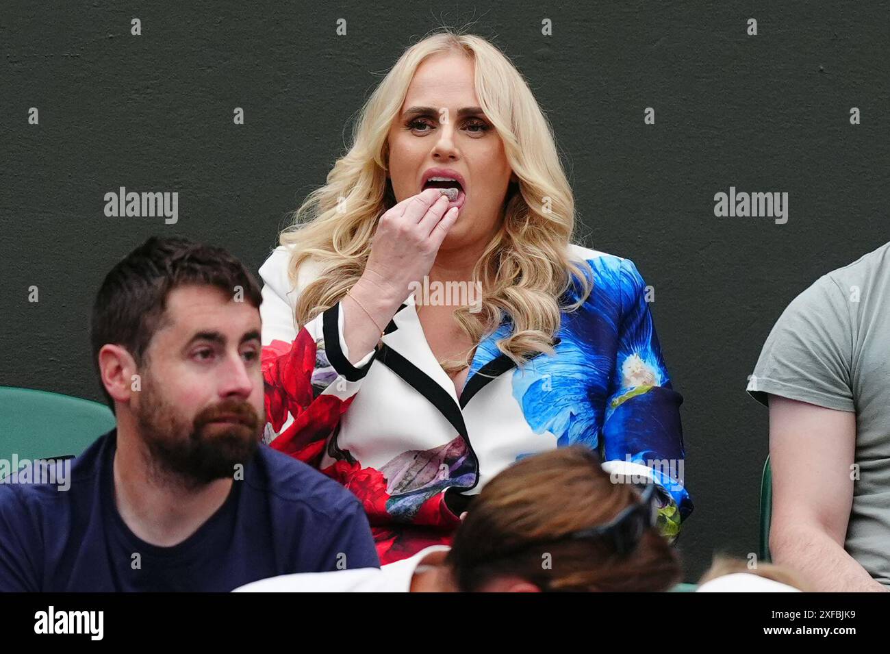Rebel Wilson watches the centre court action between Novak Djokovic and ...