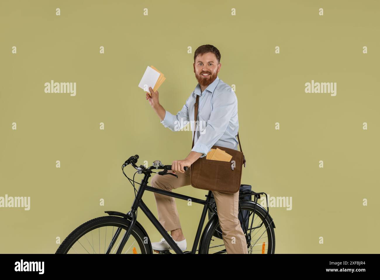 Postman on bicycle delivering letters against light green background ...
