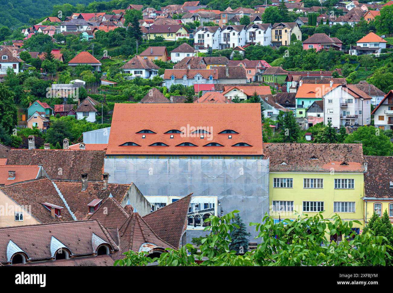 roofscape of Sighisoara (Schaesburg) in Transsylvania with a house with ...