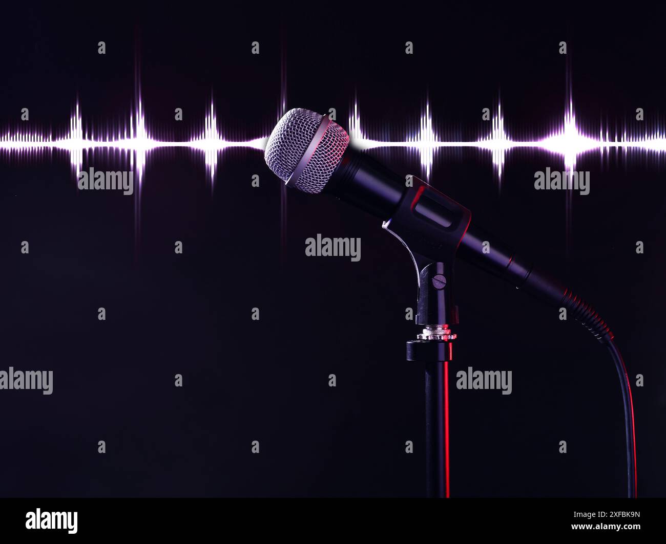 Microphone and audio waveform on dark background Stock Photo - Alamy