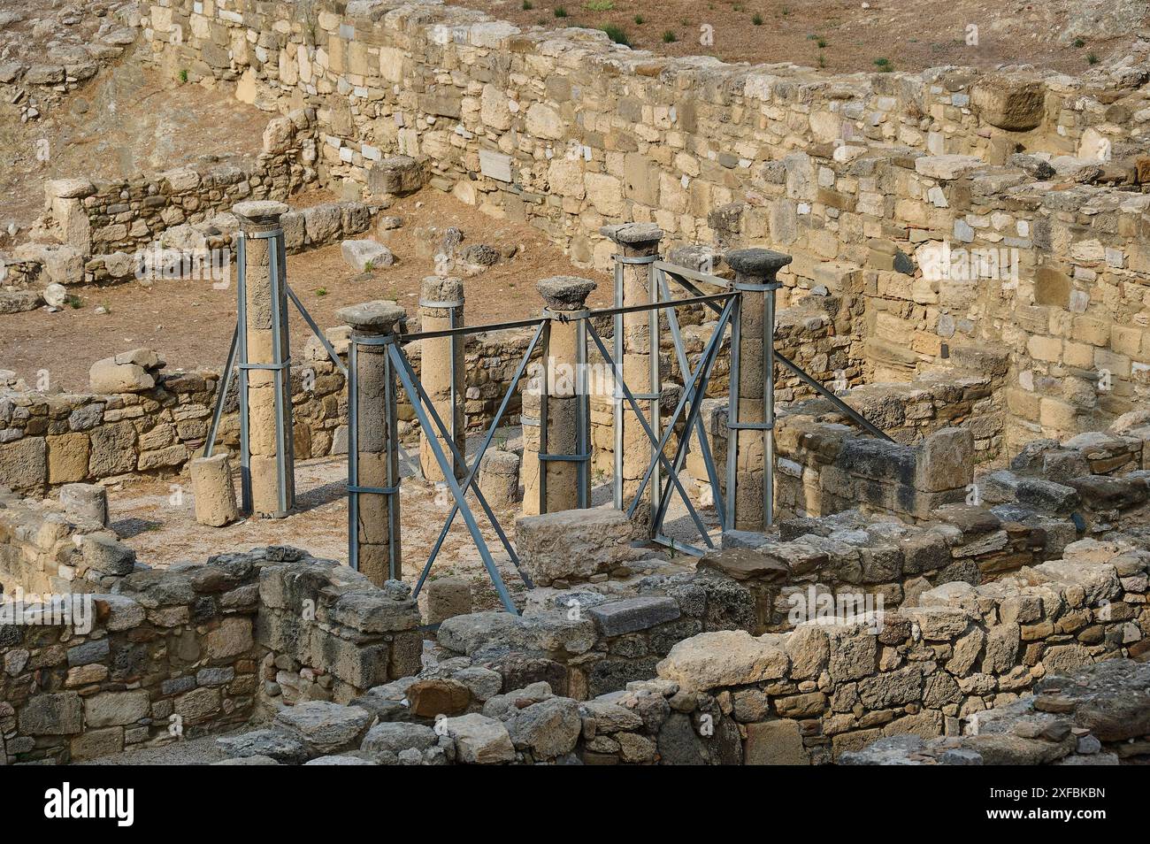 Archaeological site with ruins and stone columns in the open air ...