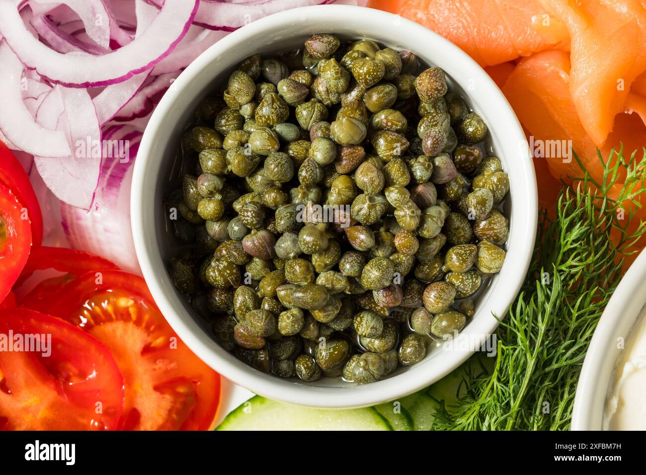 Pickled capers in green hi-res stock photography and images - Alamy