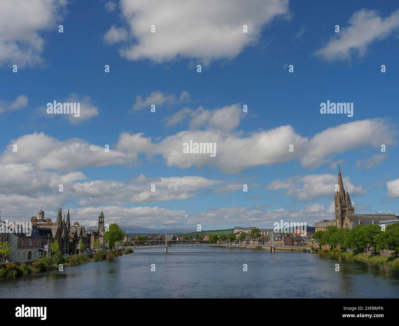Cityscape with a view of a river, a bridge and towers of historic ...