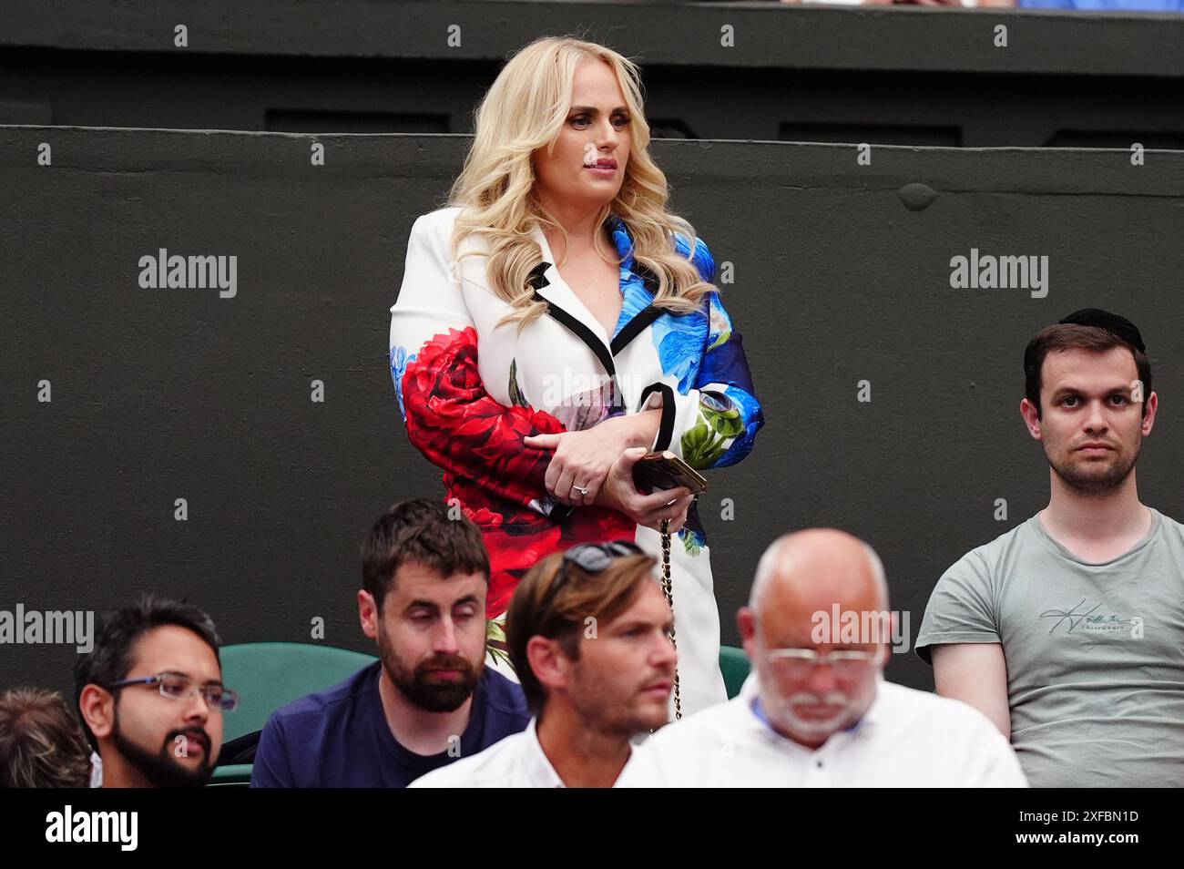 Rebel Wilson watches the centre court action between Novak Djokovic and ...