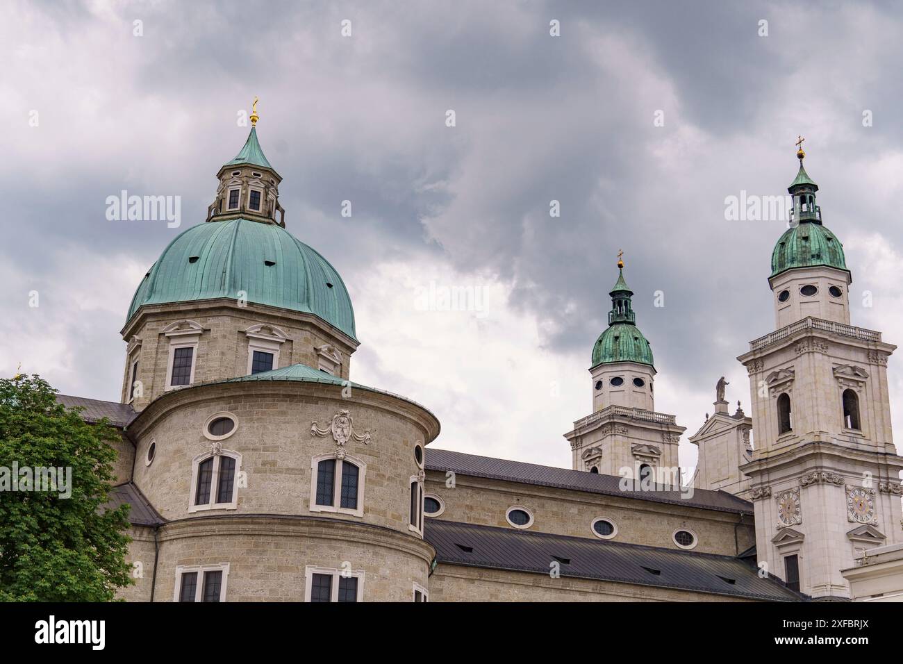 Historic church with striking towers and domes under a cloudy sky ...