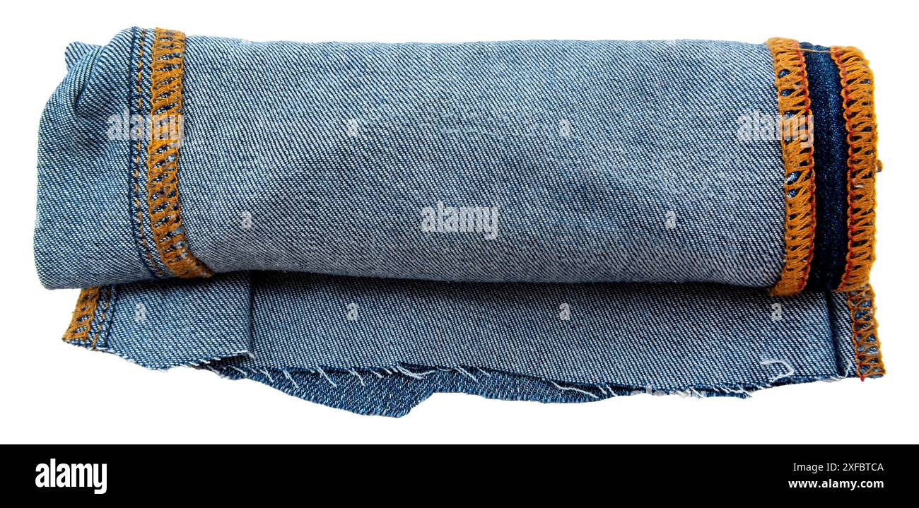 Twisted piece of blue denim on a white background. Material. Denim ...
