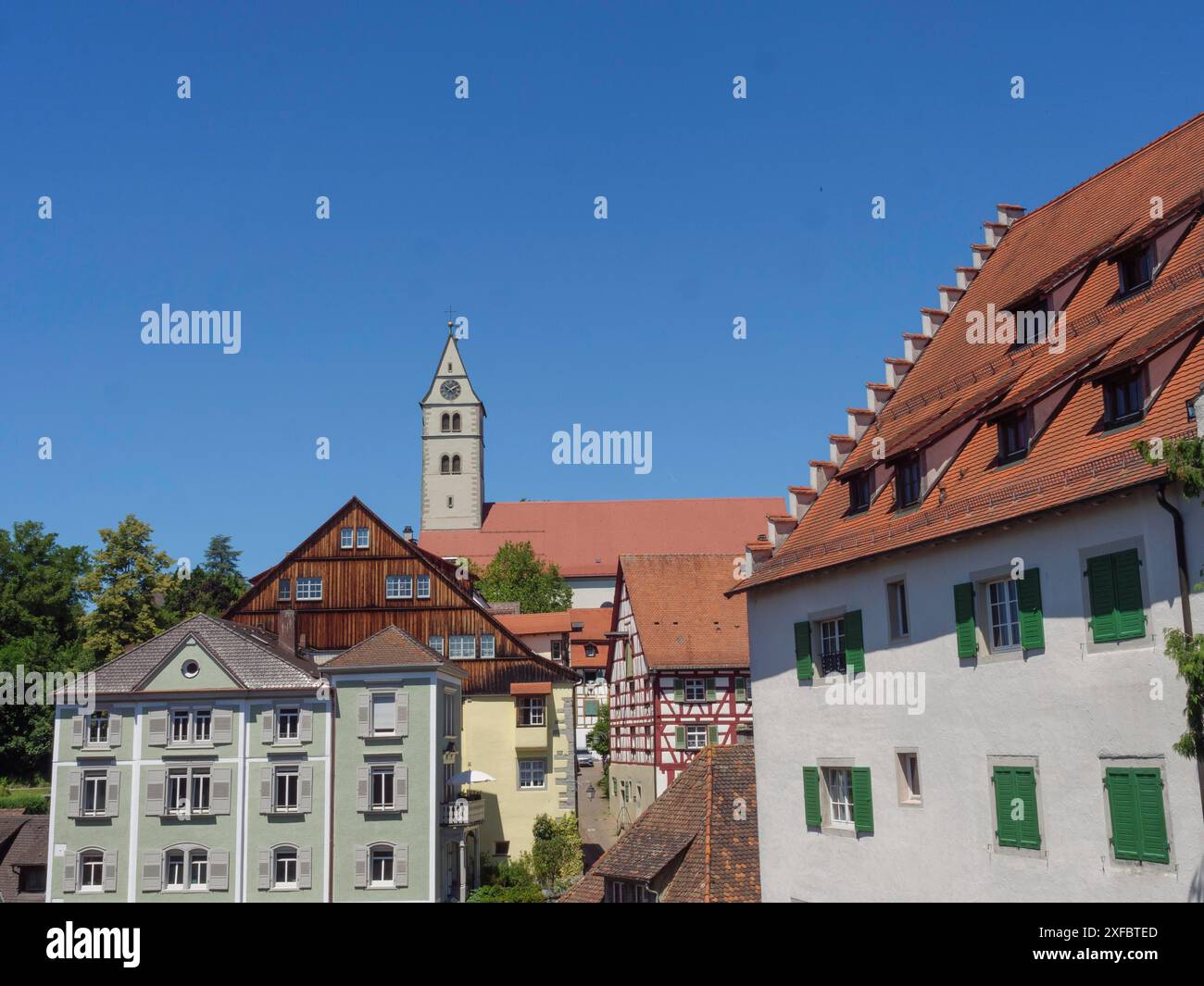 Charming village with colourful, traditional houses and a high church ...