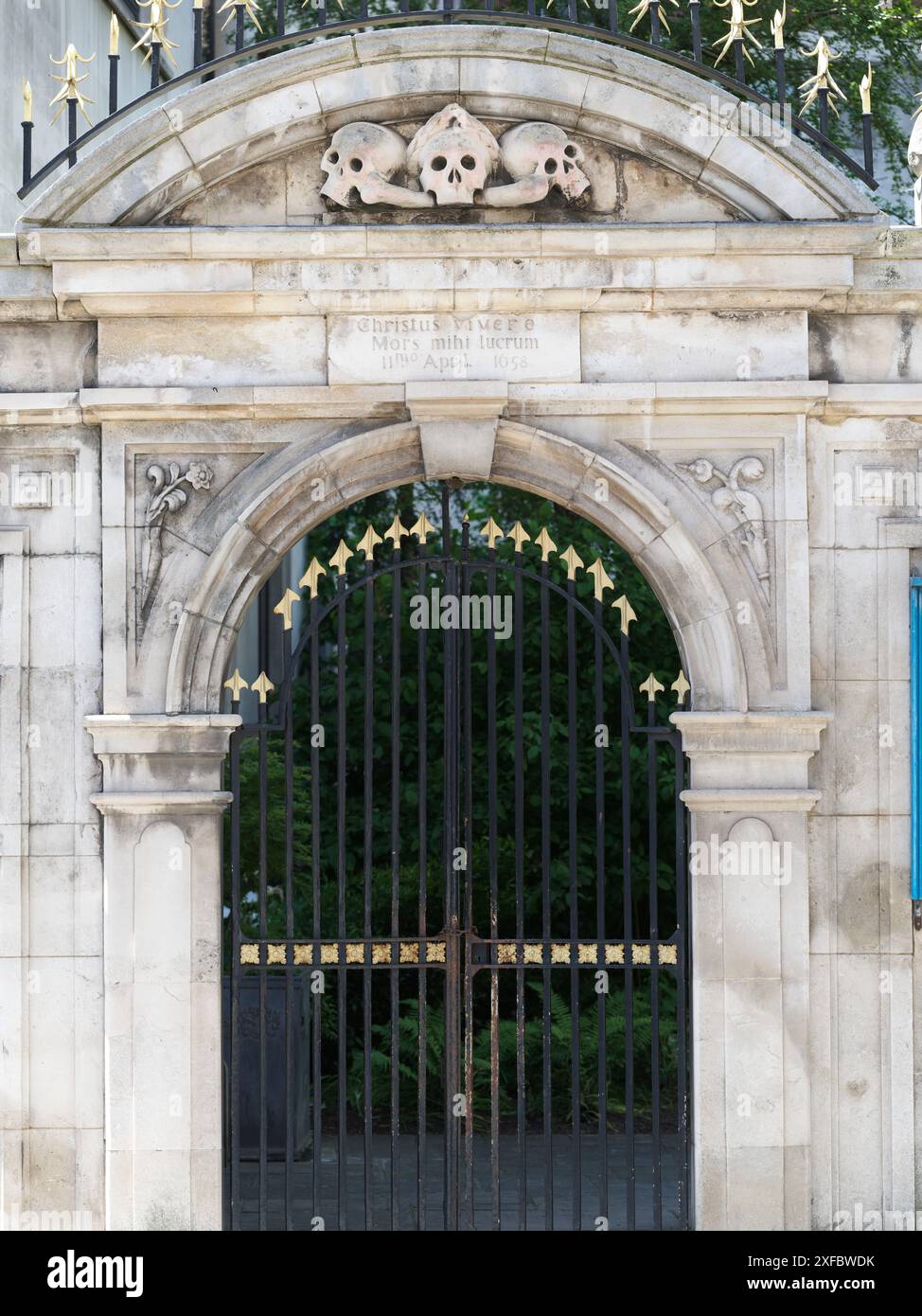 Skulls above entrance to churchyard and cemetery at St Olave's ...
