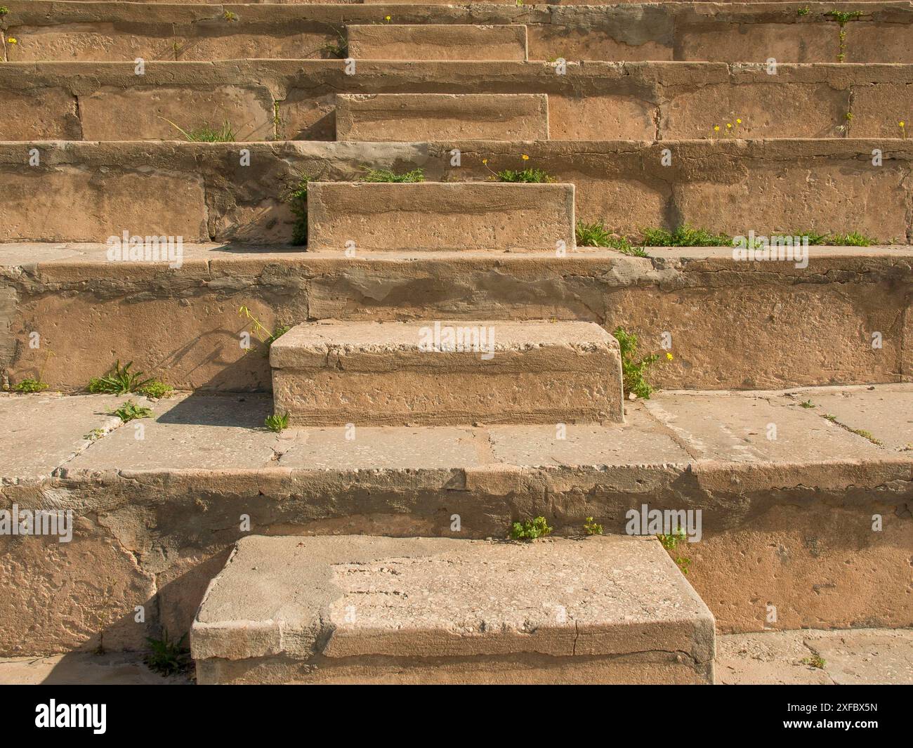 Stone steps made of brown sandstone with moss growth, part of an old ...