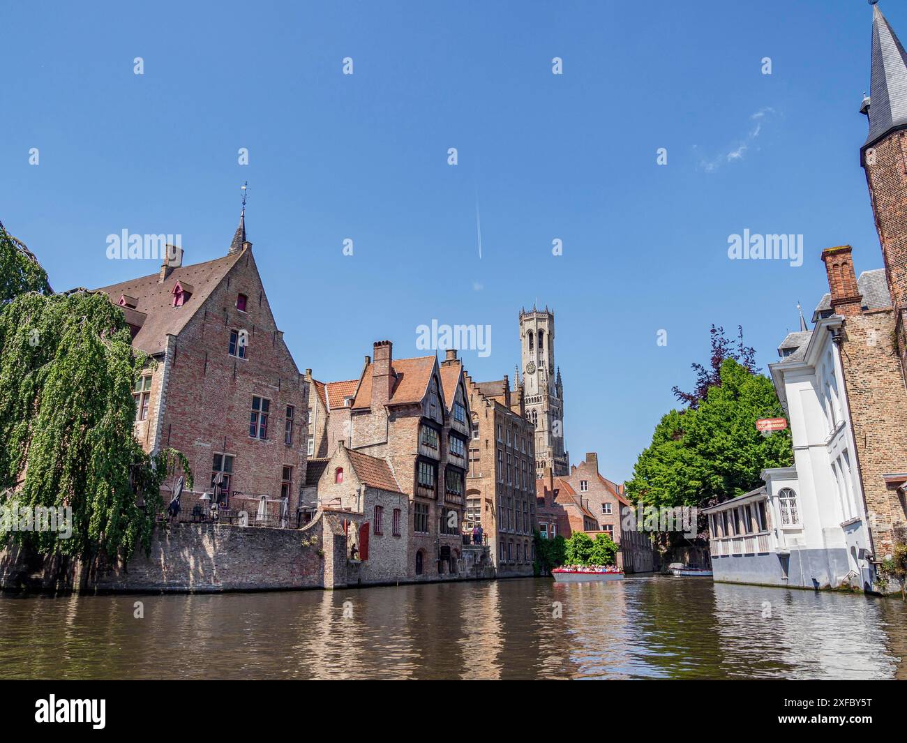 Panorama of a medieval canal with historic buildings and a clear blue ...