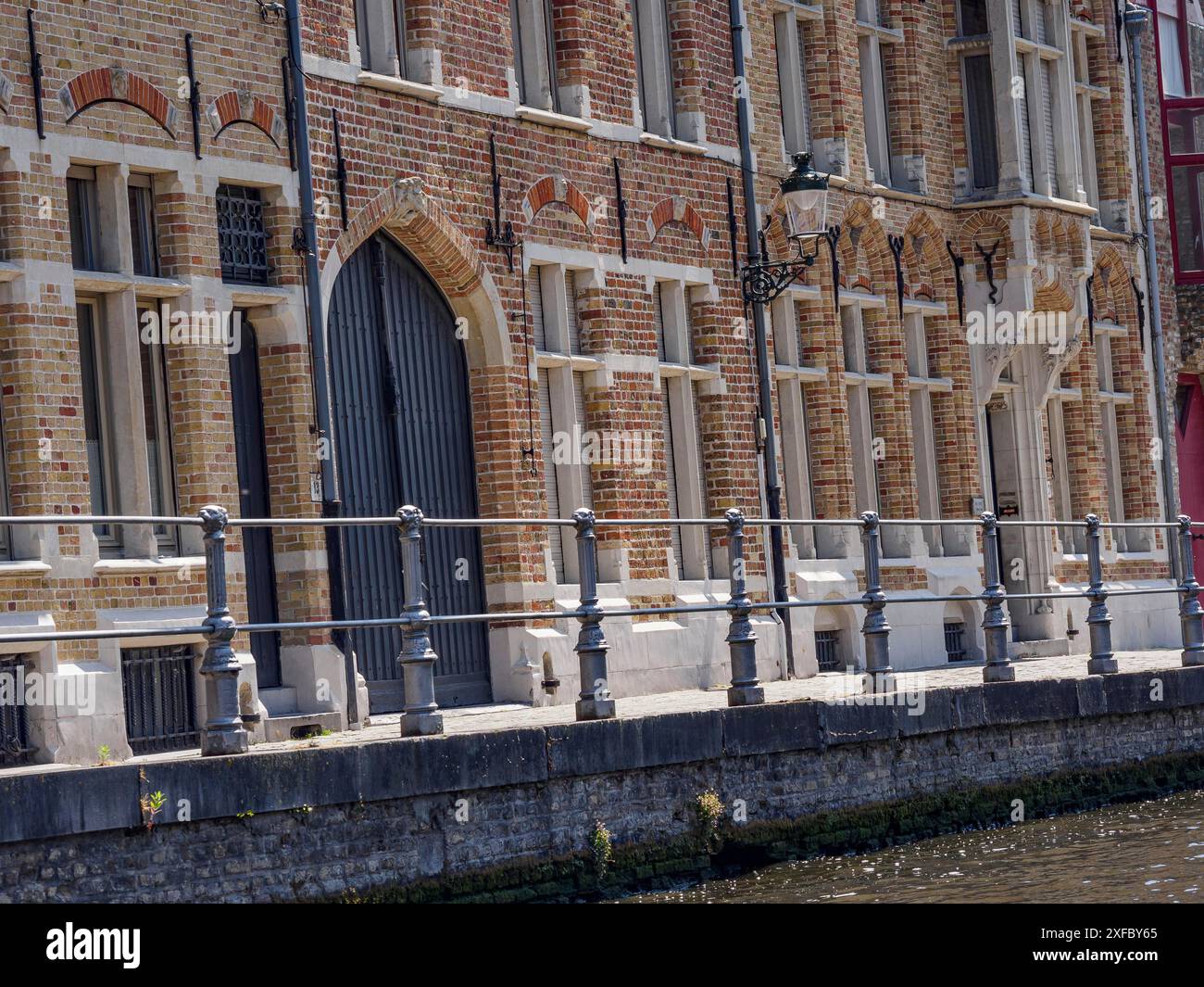 Close-up of a historic building with brick exterior wall and windows ...