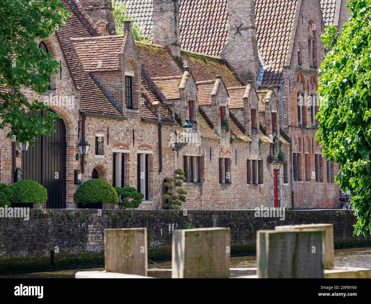 Historic brick houses with characteristic roofs and windows, Bruges ...