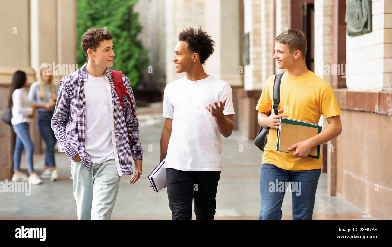 Three guys walking together in hi-res stock photography and images - Alamy