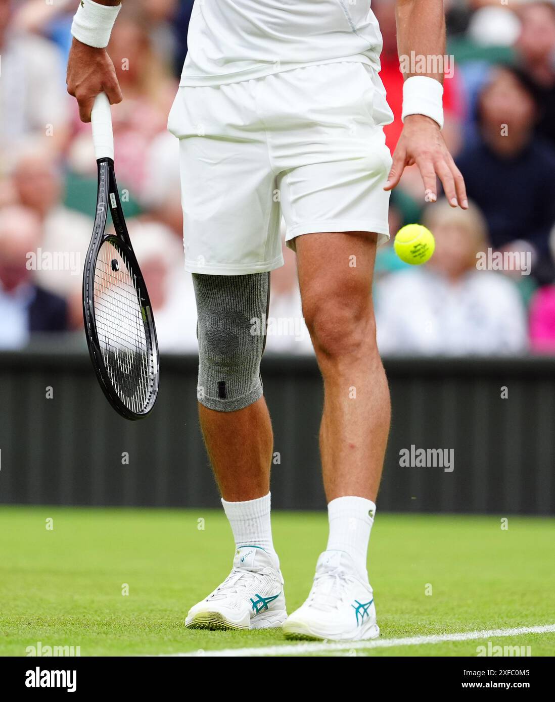 Novak Djokovic wears a knee support as he plays against Vit Kopriva on ...
