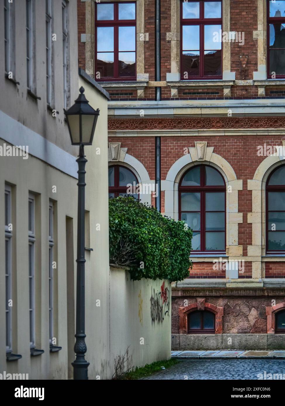 Historic building with windows and street with stone pavement ...