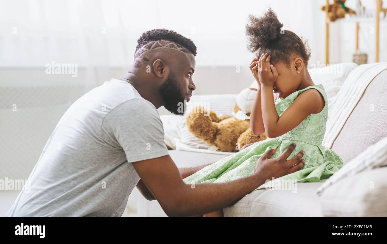 Father Comforting Upset Daughter on Couch at Home Stock Photo - Alamy