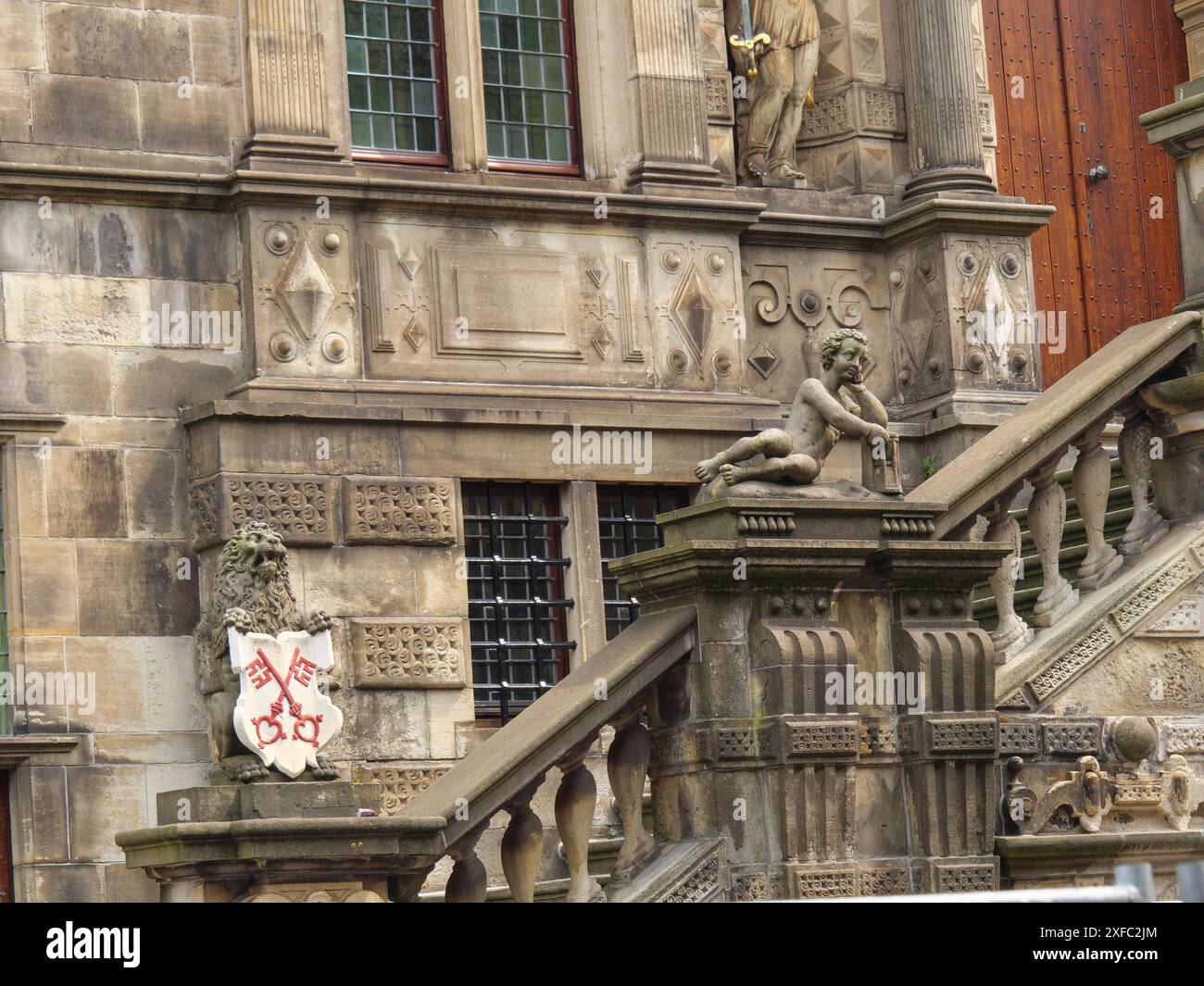 Ornate historic building with statues and coats of arms on an ...
