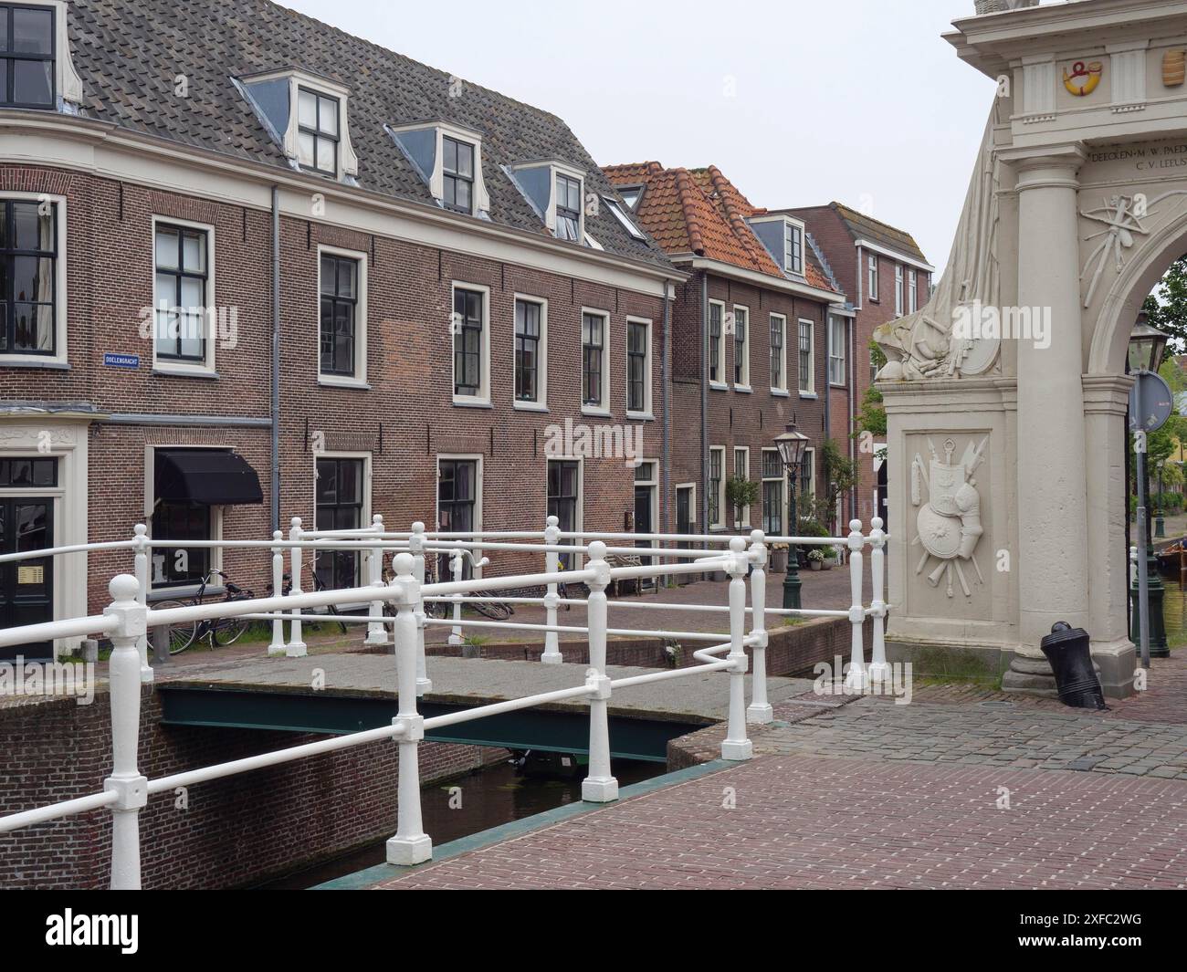 Historic bridge and brick houses in an old town centre with a ...