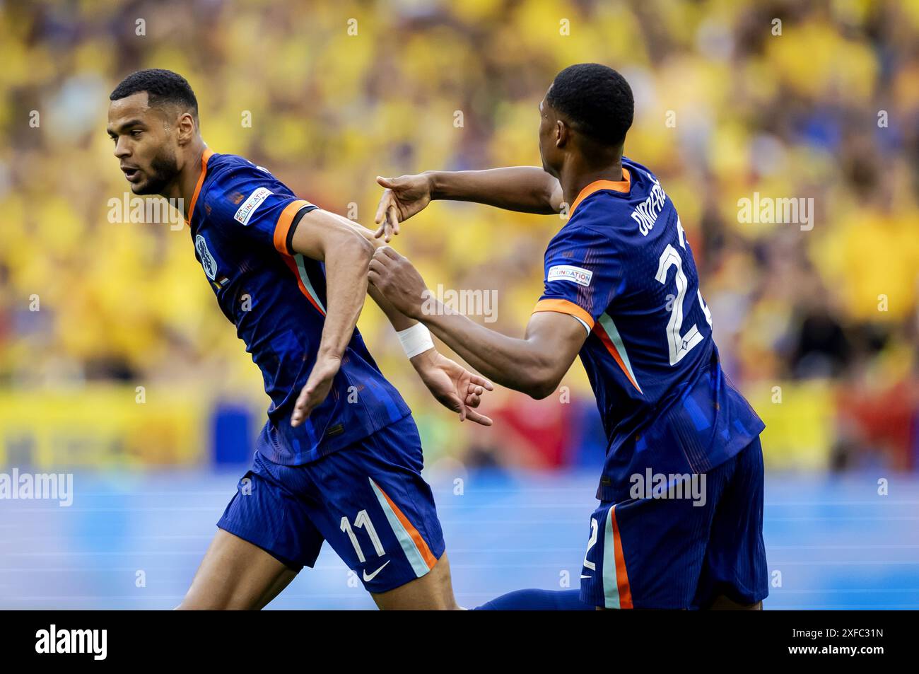 MUNICH - Cody Gakpo of Holland and Denzel Dumfries of Holland cheer ...