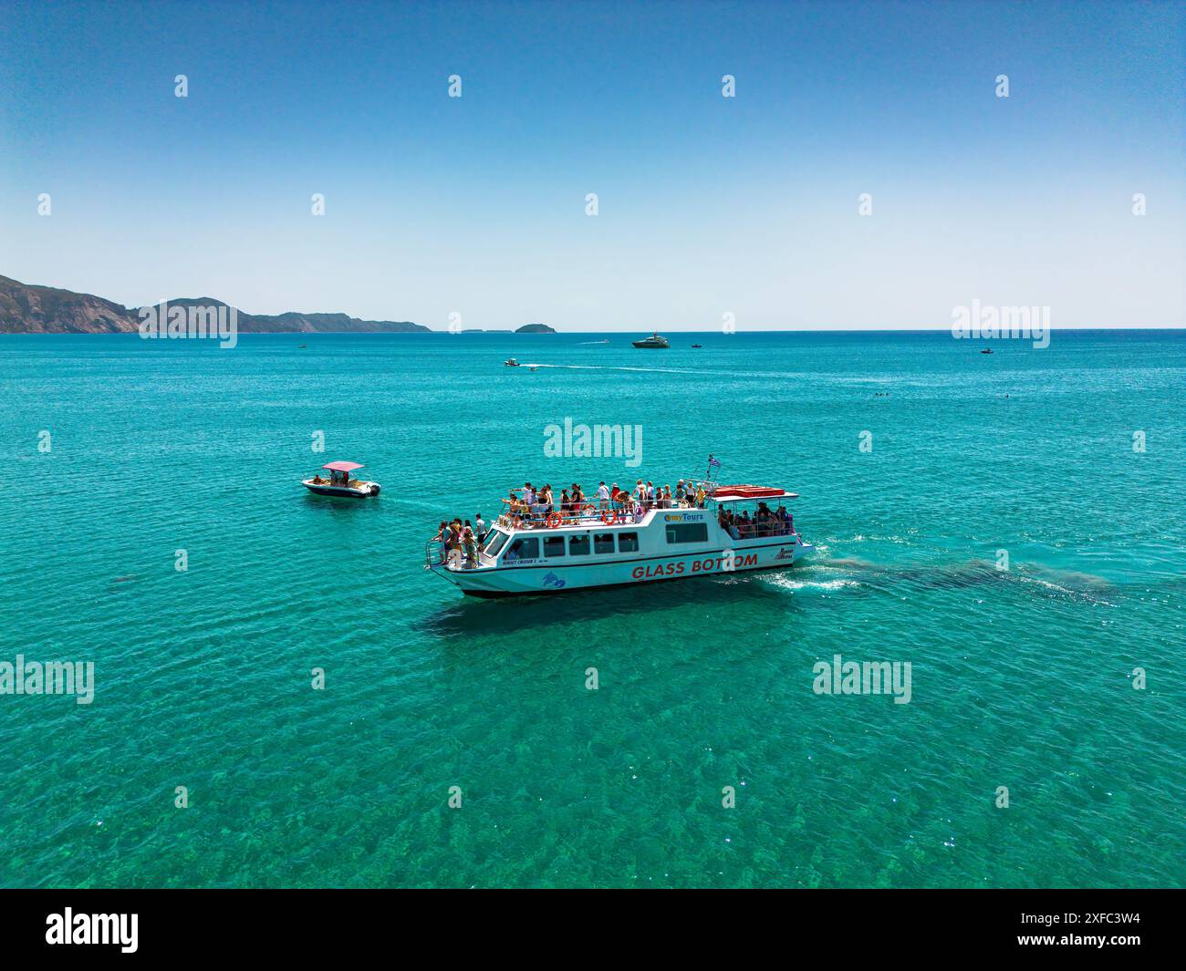 ZAKYNTHOS, GREECE - JUNE 20 2024 Tourists enjoy the cruise around ...