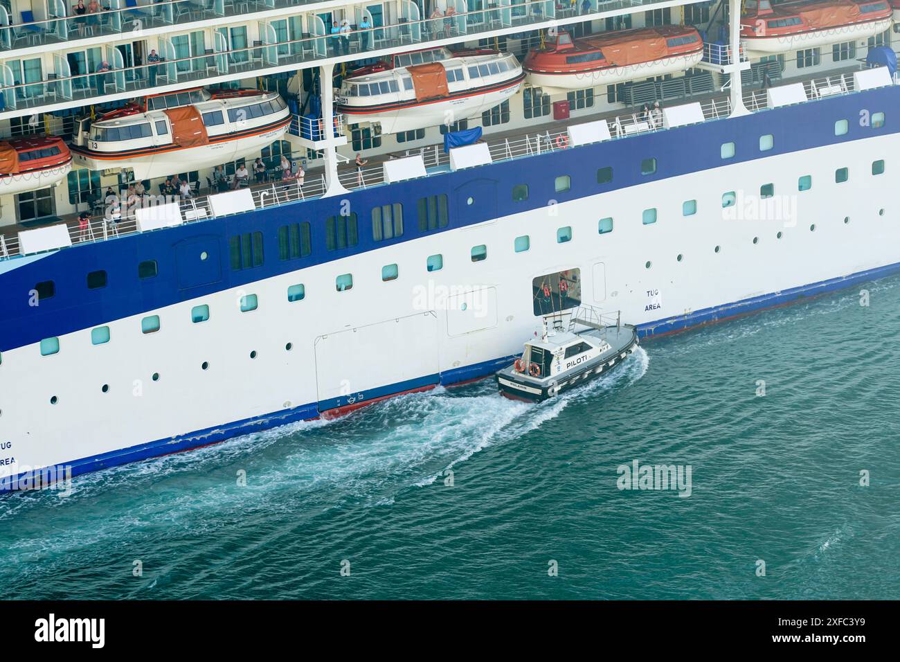 Civitavecchia, Italy- May 22, 2024: port pilot boat next to cruise ship ...
