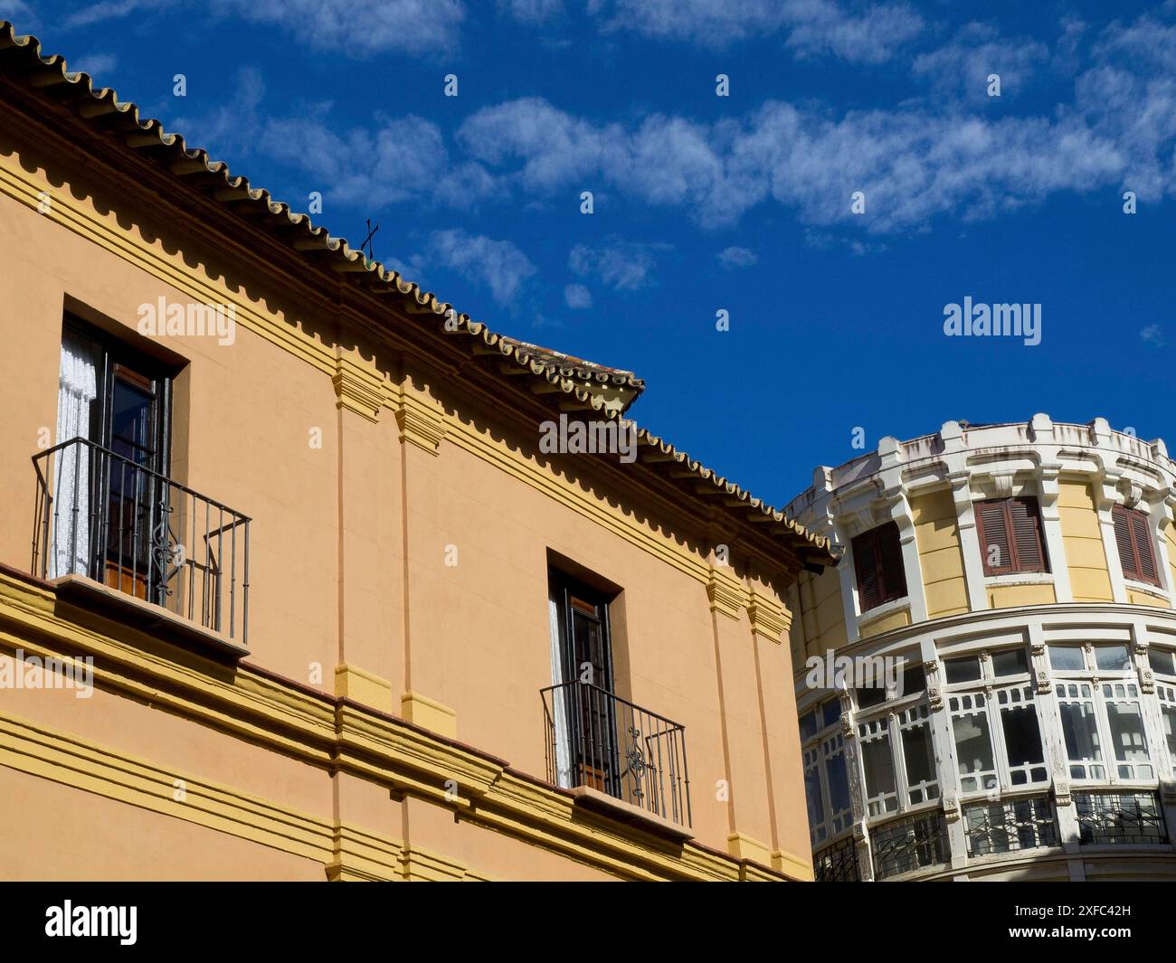 Classic old town buildings with balconies and windows in front of a ...