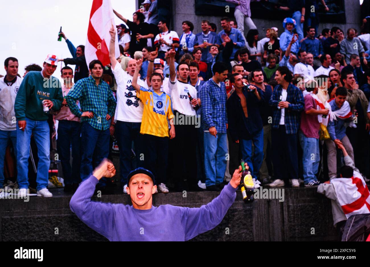 England supporters celebrated on the plinth of Nelson’s column in ...